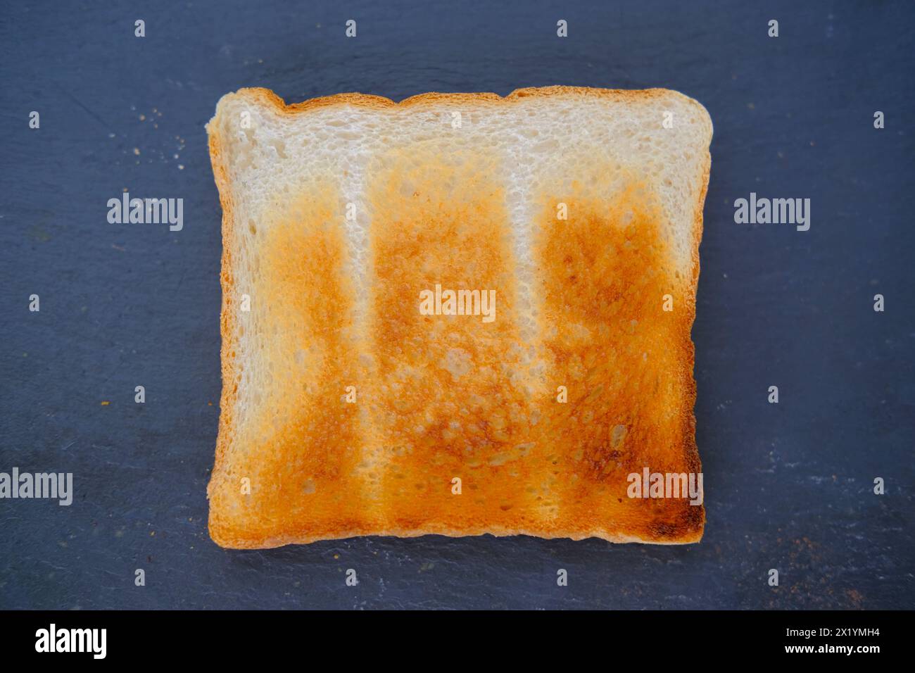 toasted grain bread in a toaster, roasted sandwich toast, concept of ...