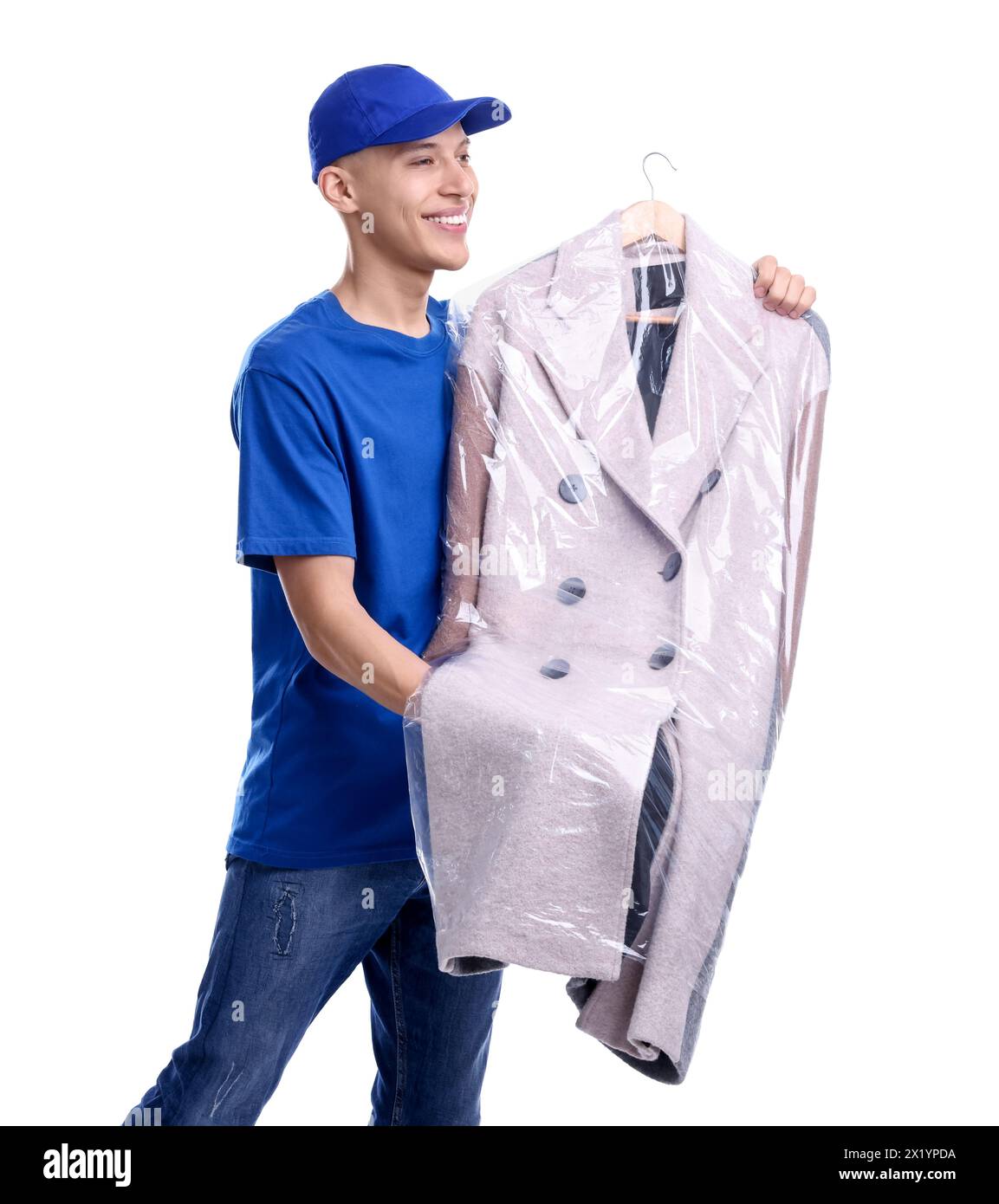 Dry-cleaning delivery. Happy courier holding coat in plastic bag on ...