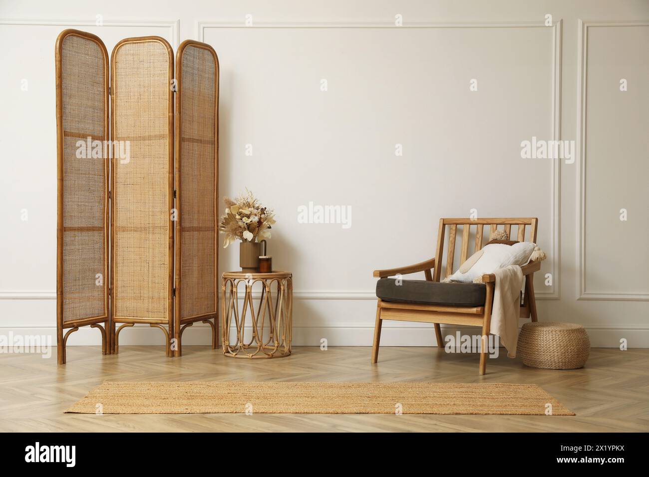 Stylish room with folding screen and armchair. Interior design Stock ...
