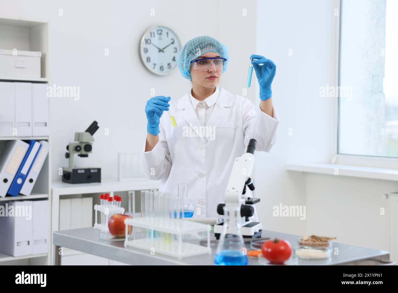 Quality control. Food inspector checking safety of products in ...