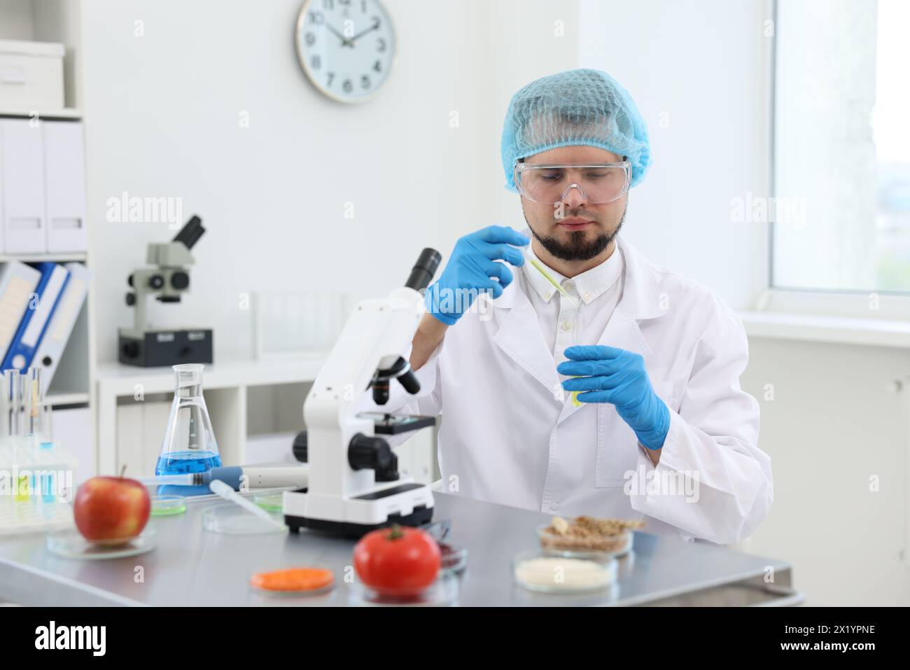 Quality control. Food inspector checking safety of products in ...