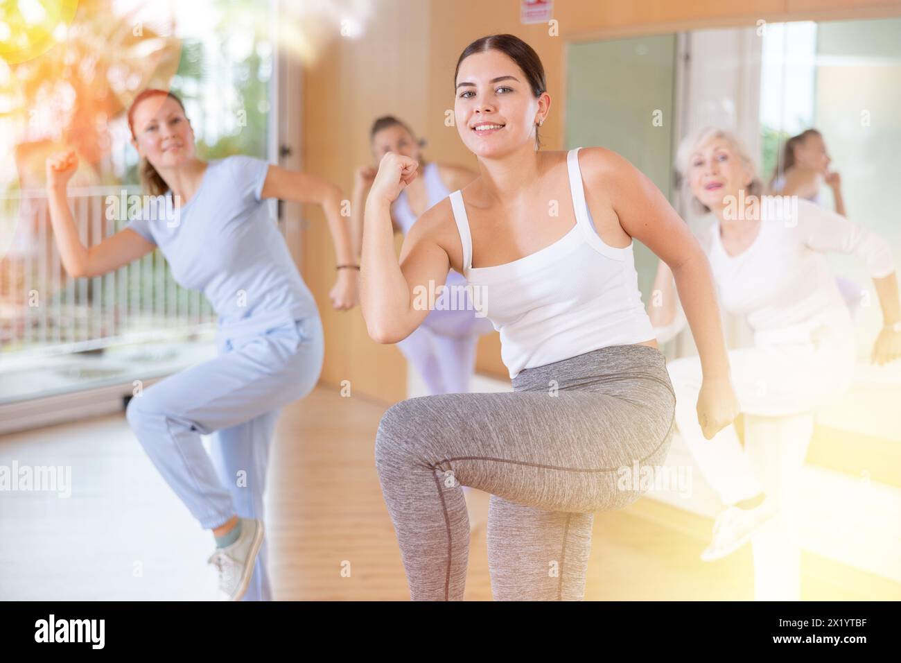 Different ages women learning swing steps at dance class Stock Photo ...