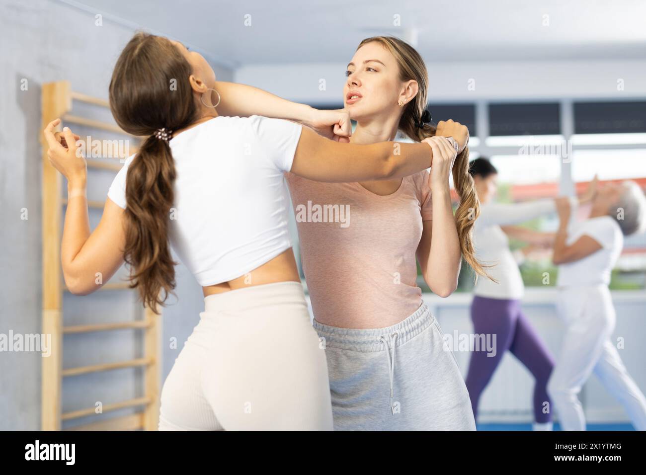 Two young women training self-defense techniques Stock Photo - Alamy