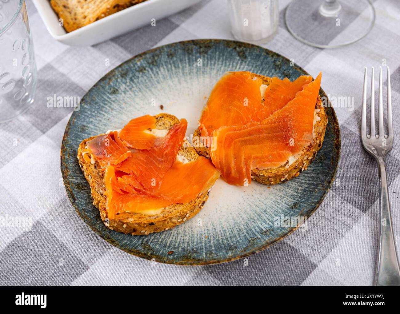 canapes with delicate butter and pieces of bright pink salmon Stock ...