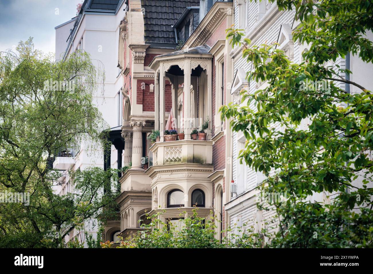 beautiful old building facades surrounded by greenery in the belgian ...