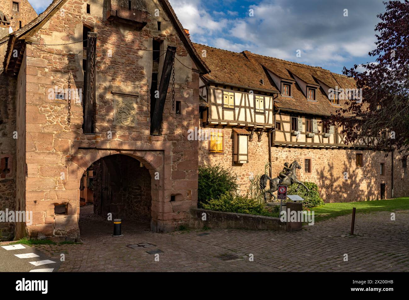 The upper gate La Porte Haute and half-timbered houses of the city ...