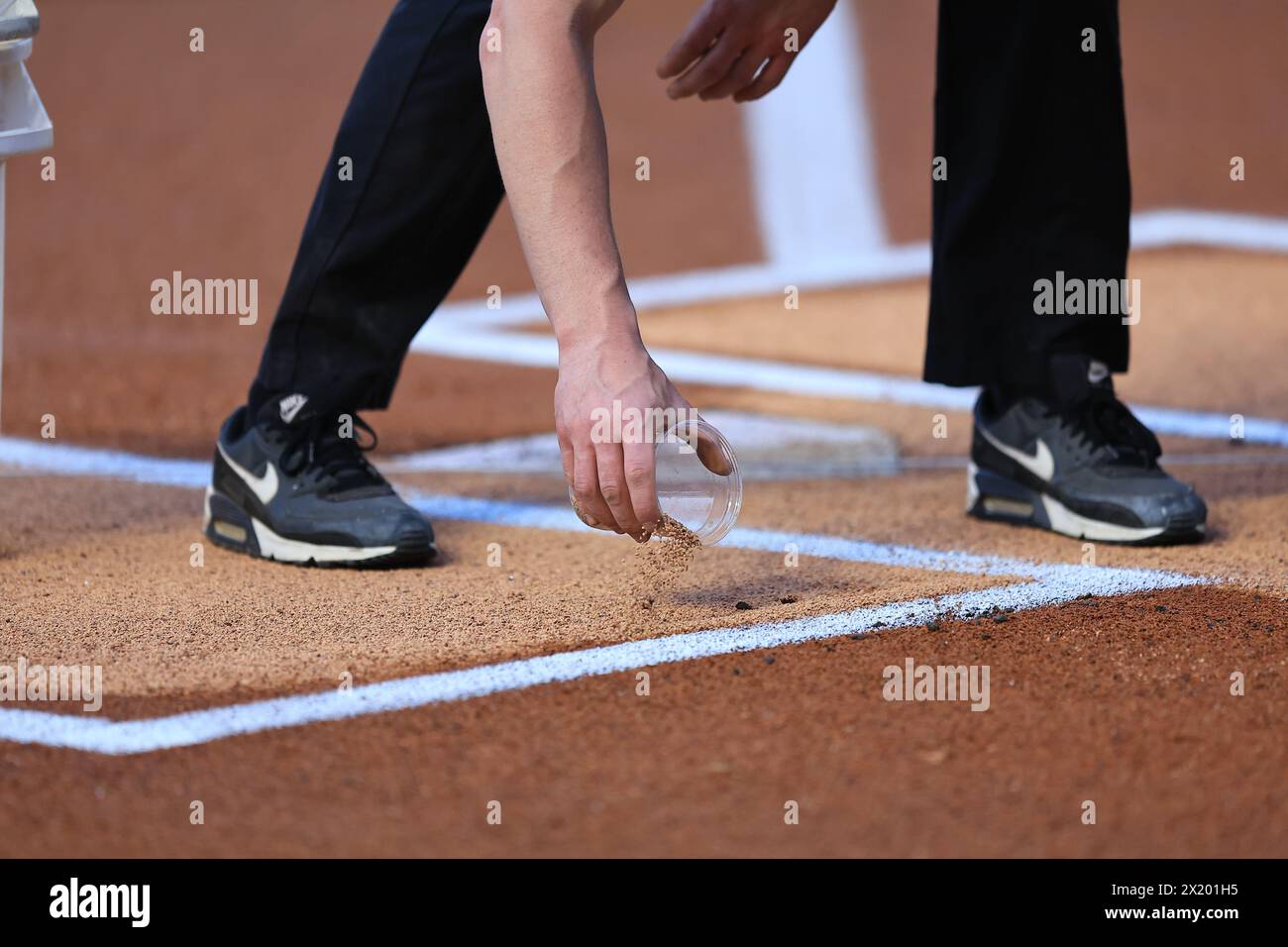 The grounds crew prepares the field before the baseball game Stock ...