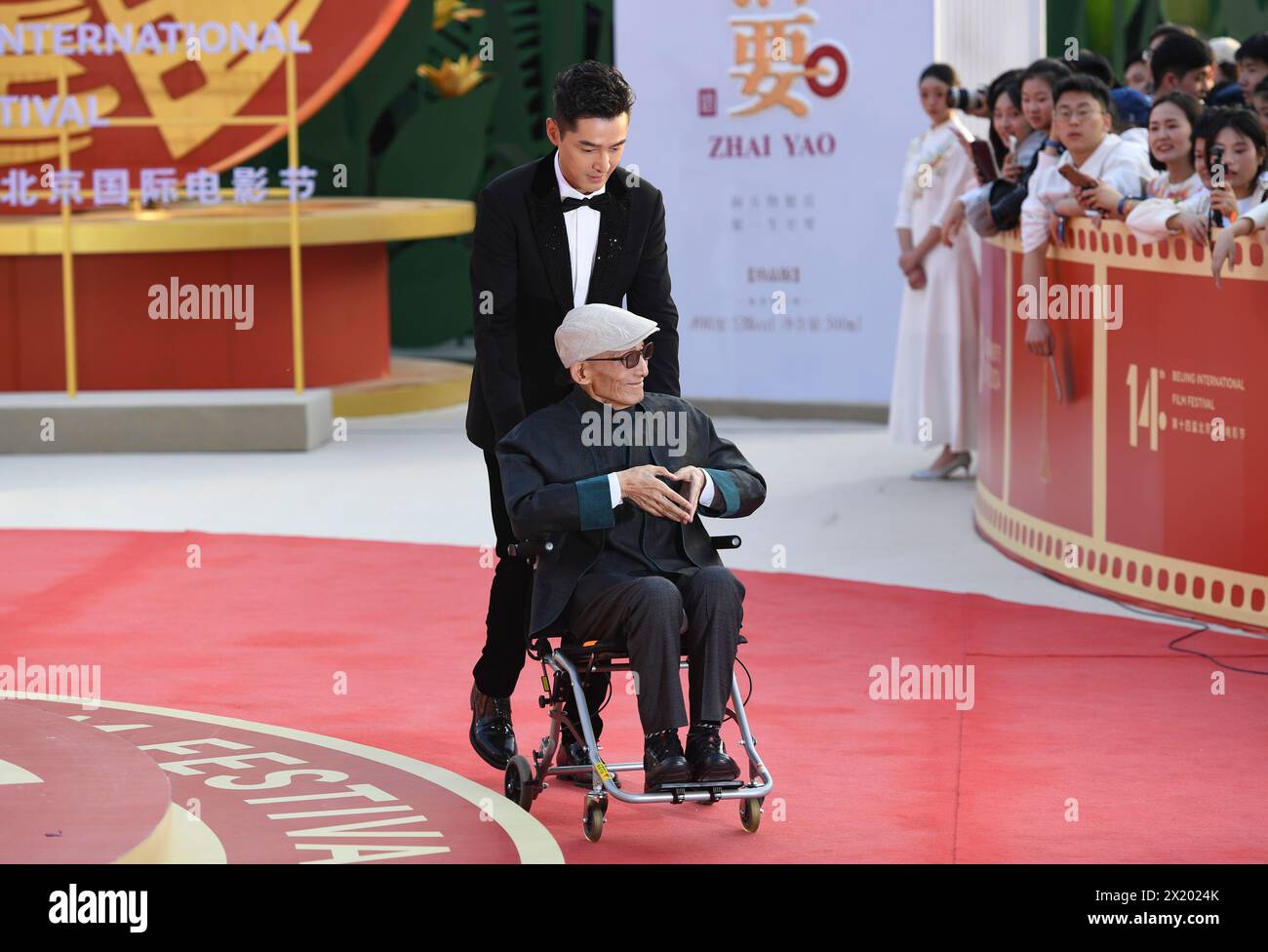 (240419) -- BEIJING, April 19, 2024 (Xinhua) -- Actor You Benchang (front) and Hu Ge attend the ...