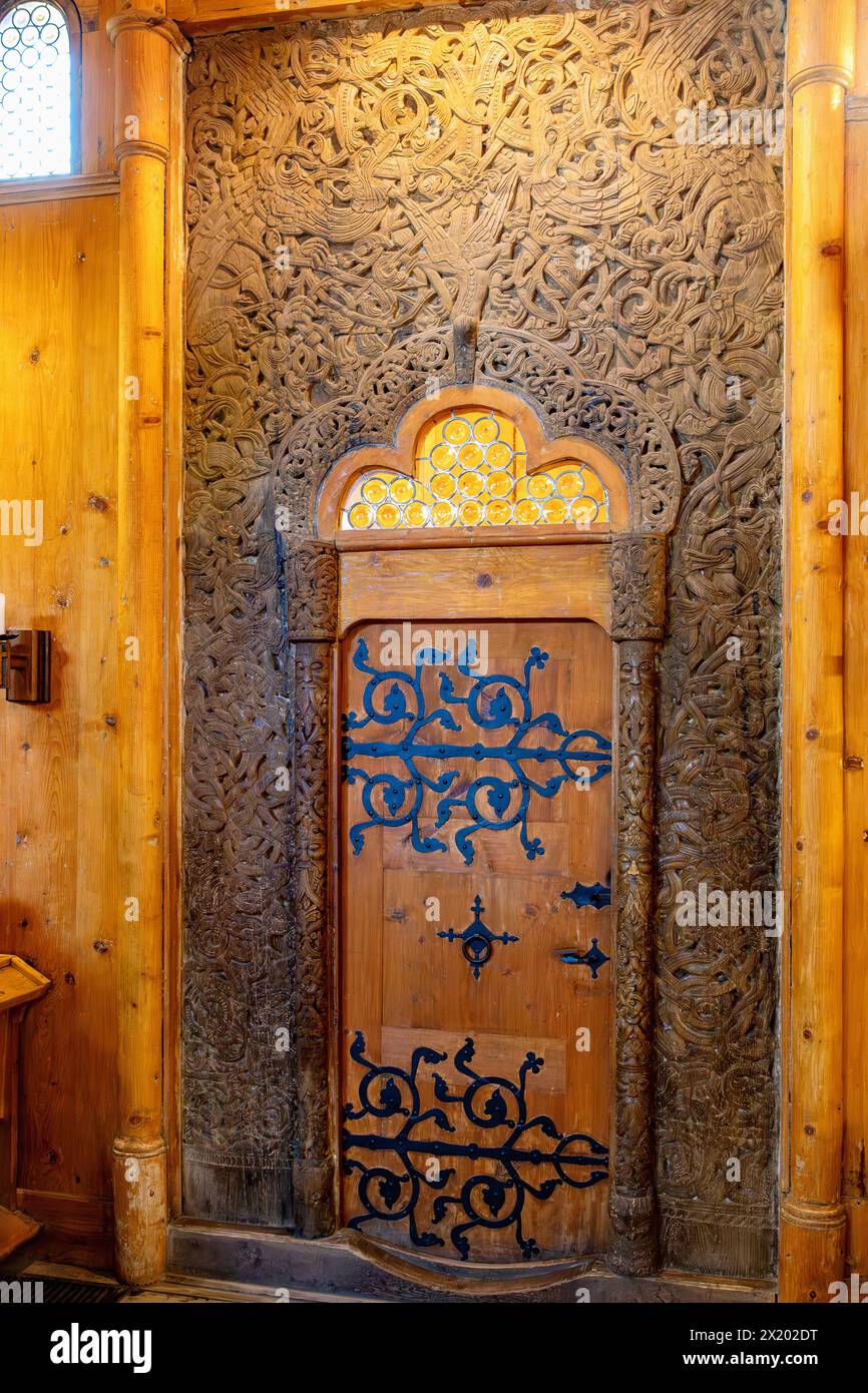 Wooden door decorated with carved motifs, Norwegian wooden stick church ...