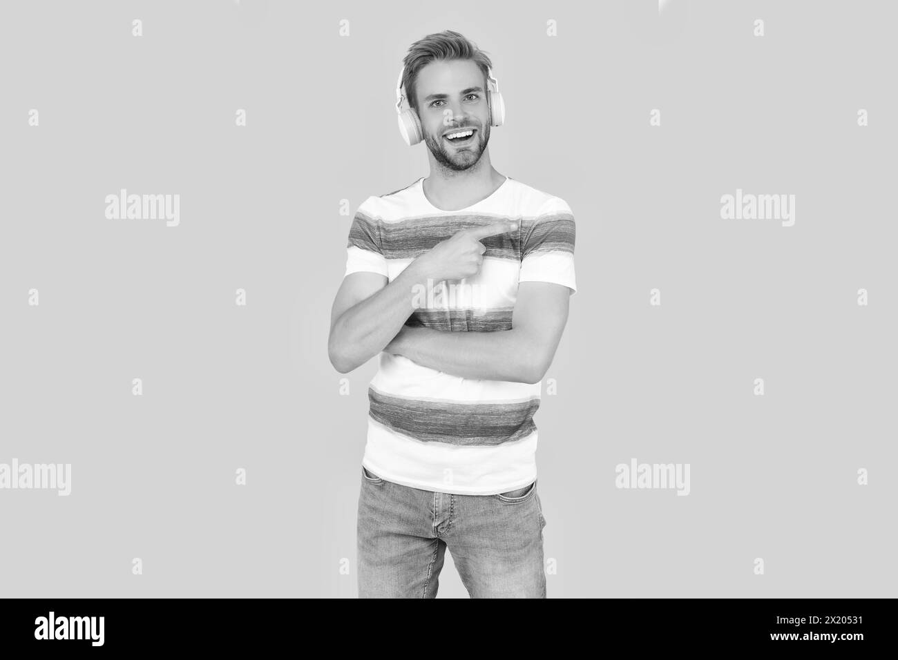 man listen and enjoys live music, point finger. man listens to music on ...