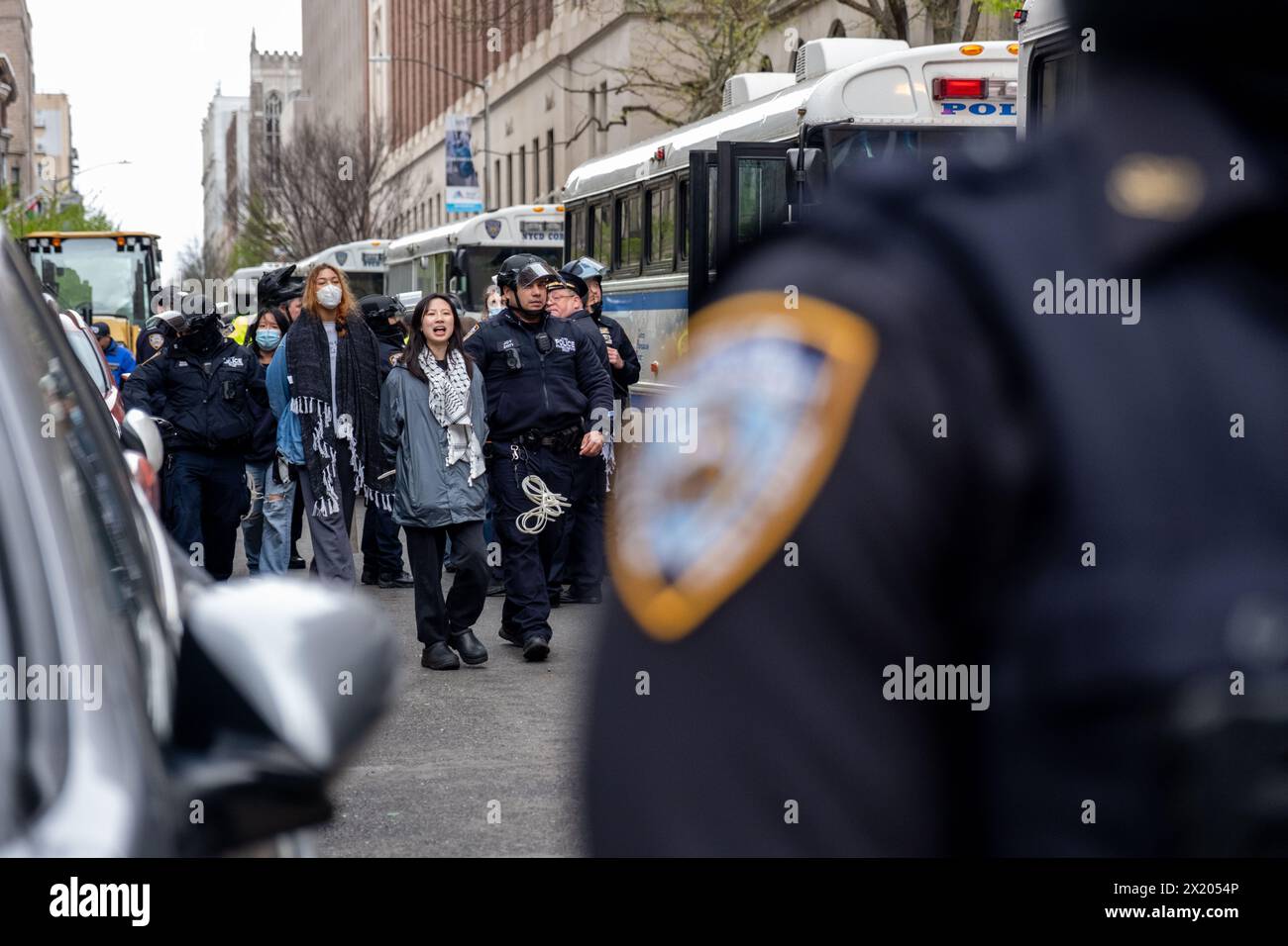 Students led by NYPD SRG officers wait to load on to the NYPD bus on ...