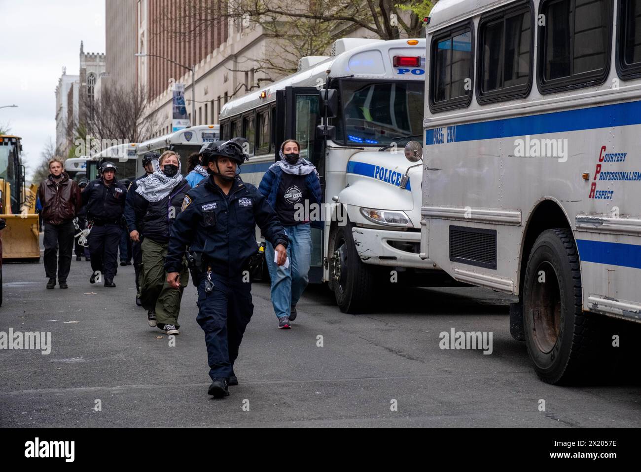 The first group of arrested students are brought to the NYPD bus. Pro ...