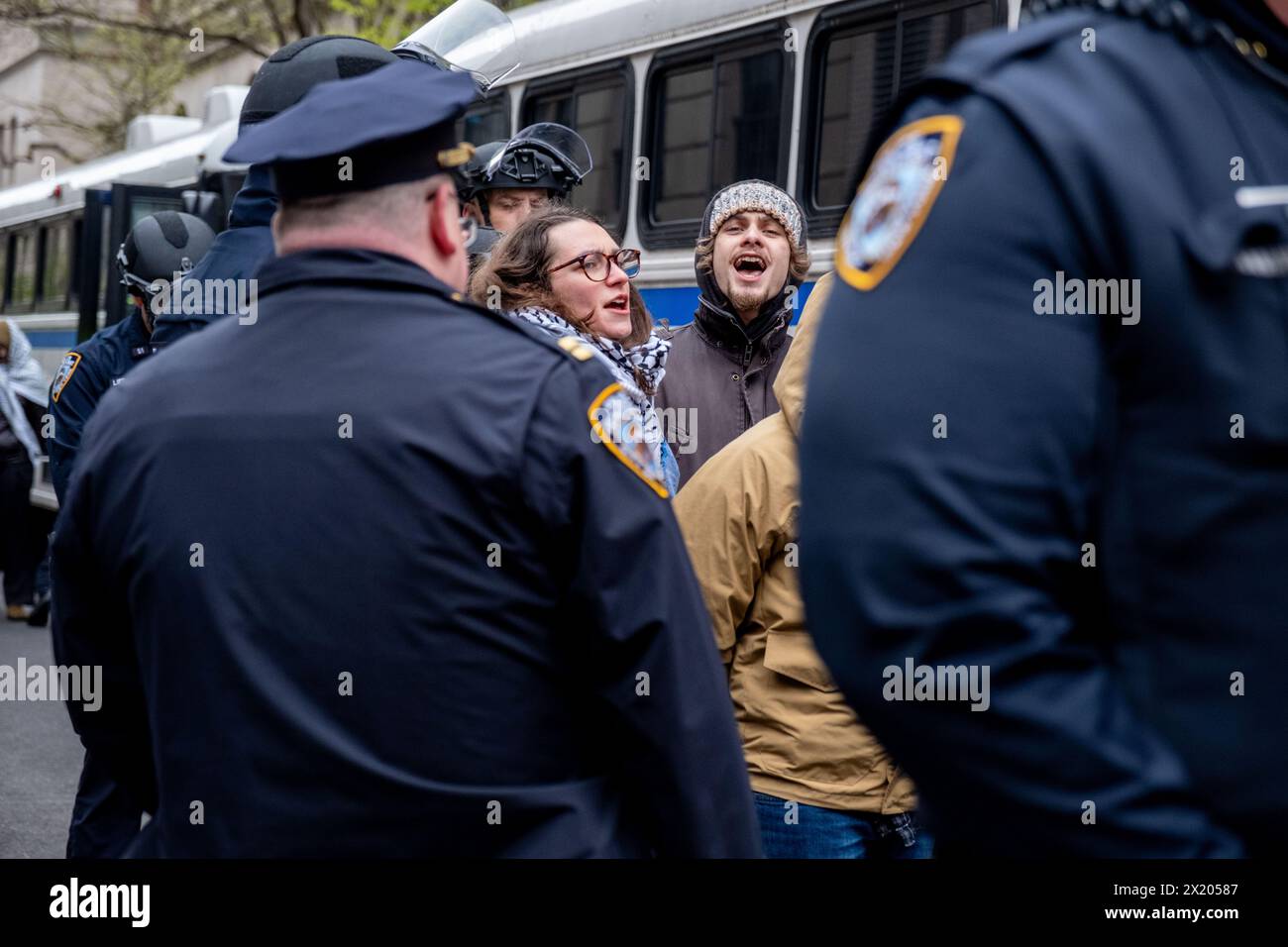 A couple of students sing as they are waiting to be loaded onto to the ...