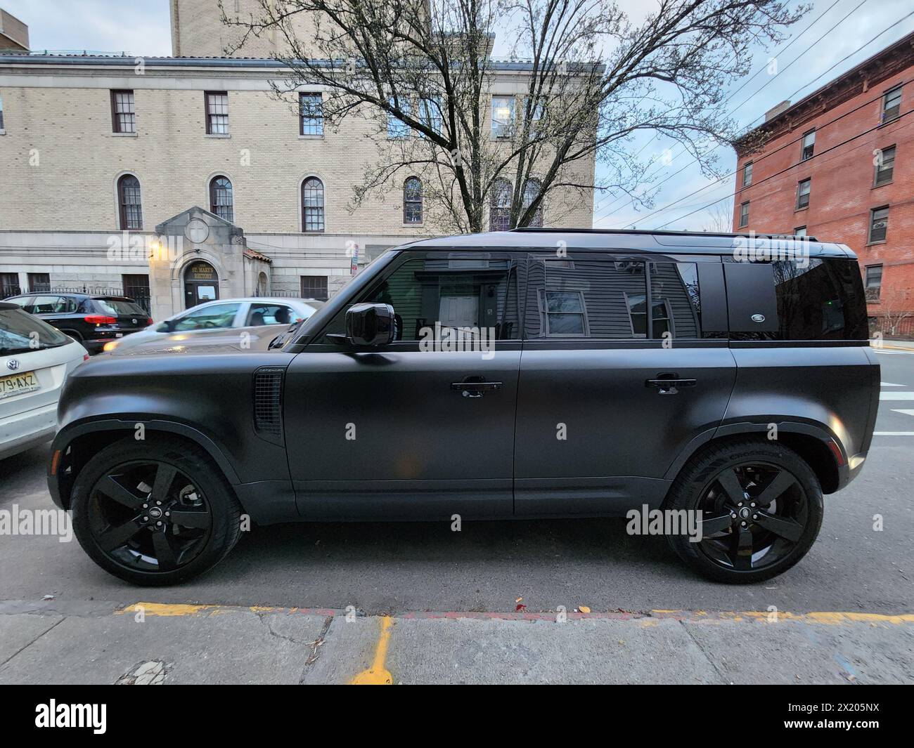 New York City, USA - March 18, 2024: Land Rover Defender matte black ...
