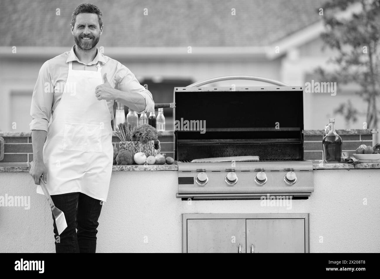 man grilling salmon fillet for barbecue, thumb up. man grilling salmon ...