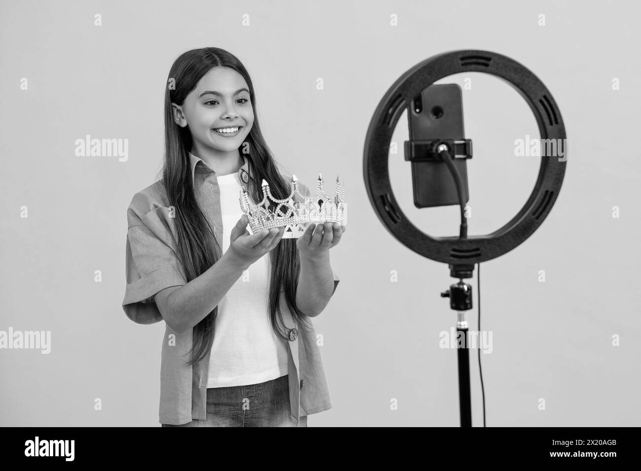 glad teen girl influencer with crown isolated on yellow. teen girl ...