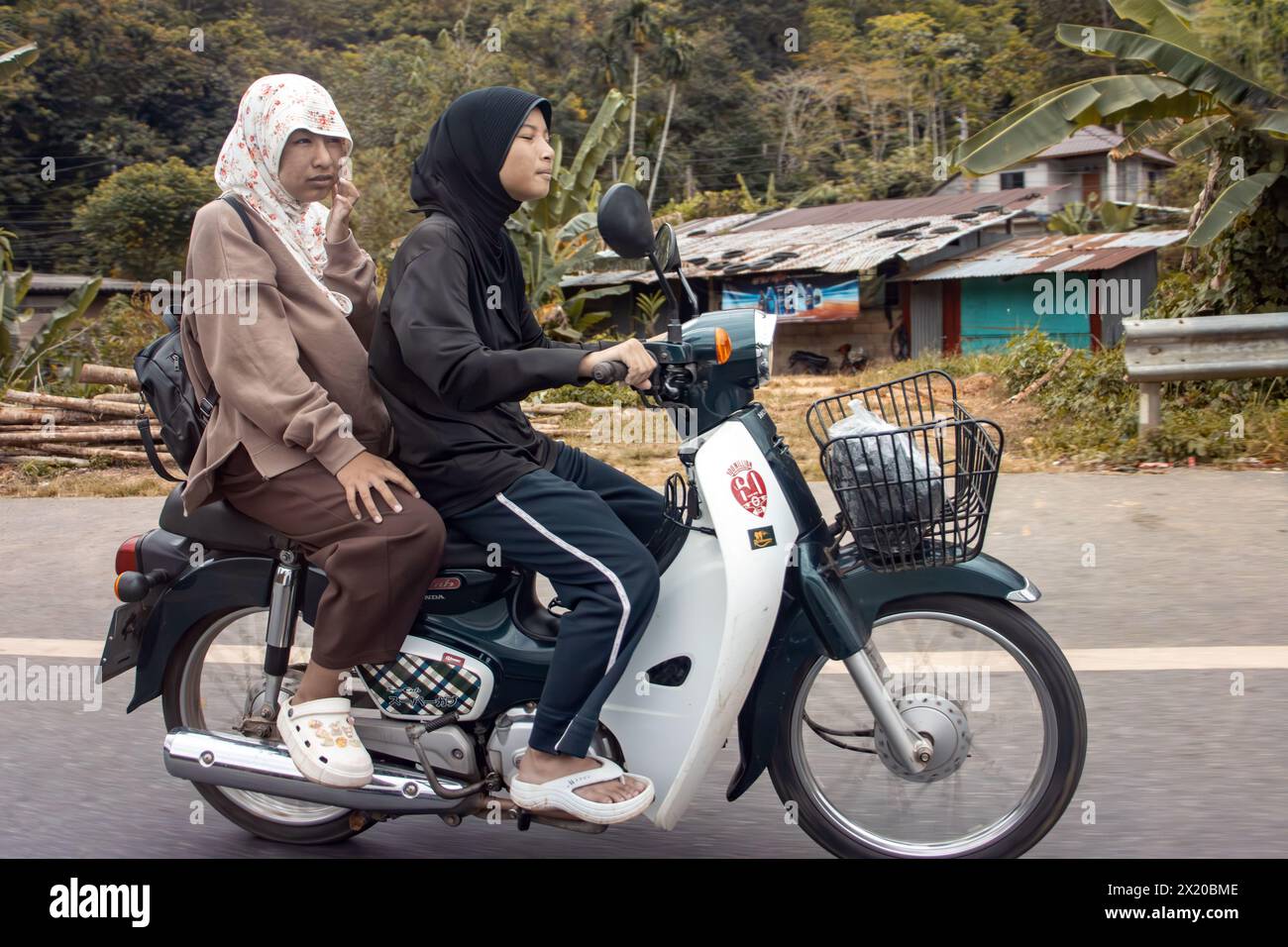 YALA, THAILAND, MAR 03 2024, A women in traditional clothing ride ...