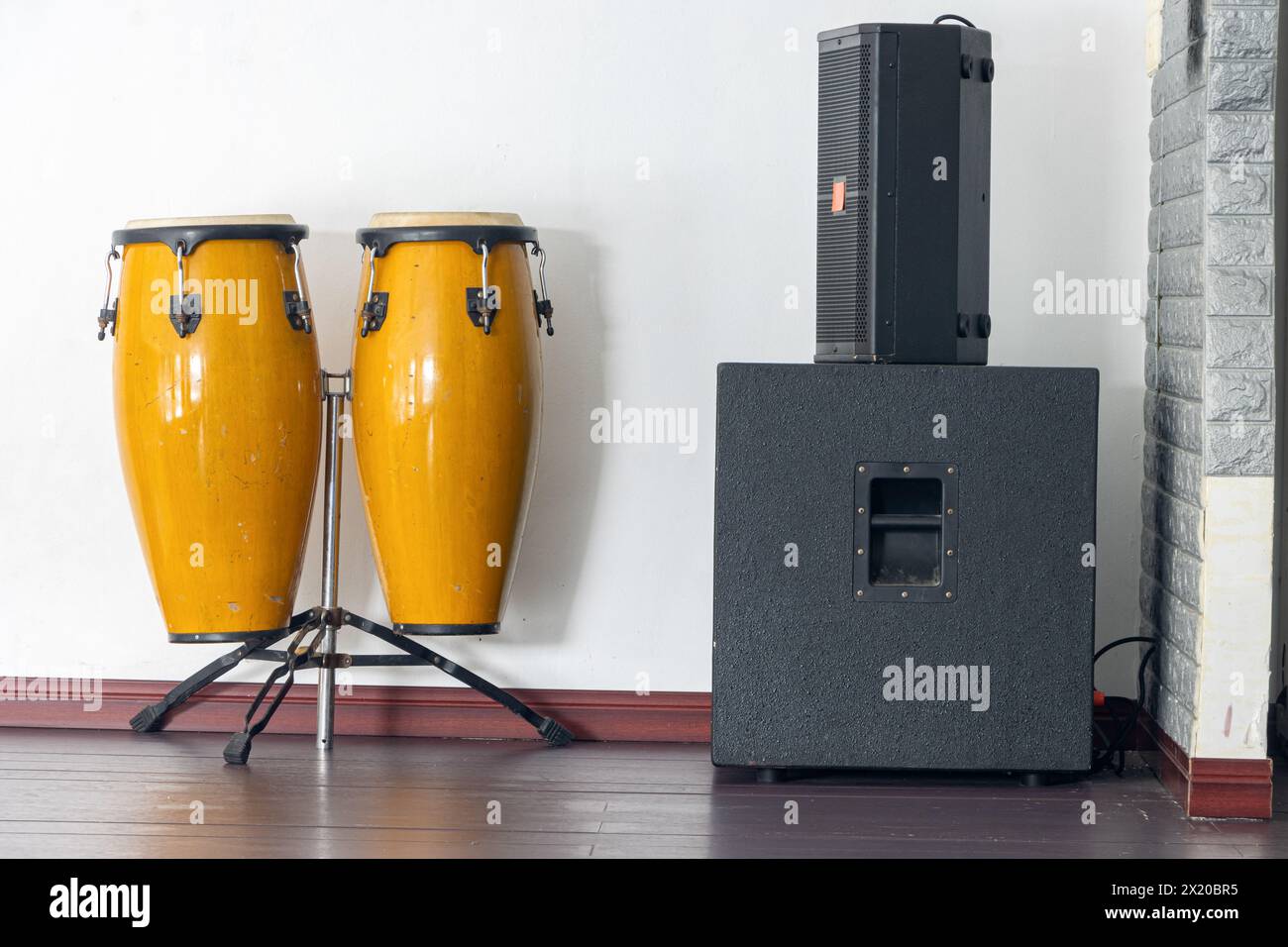 Big yellow bongos set with loud-speaker on a stage Stock Photo - Alamy