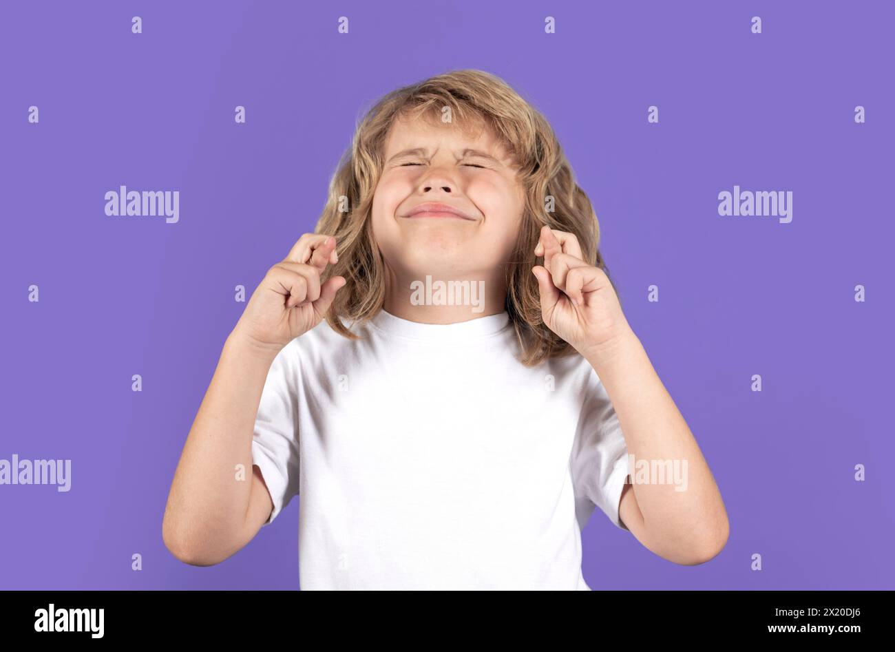 Portrait of cute smiling child crossed fingers, , isolated studio ...