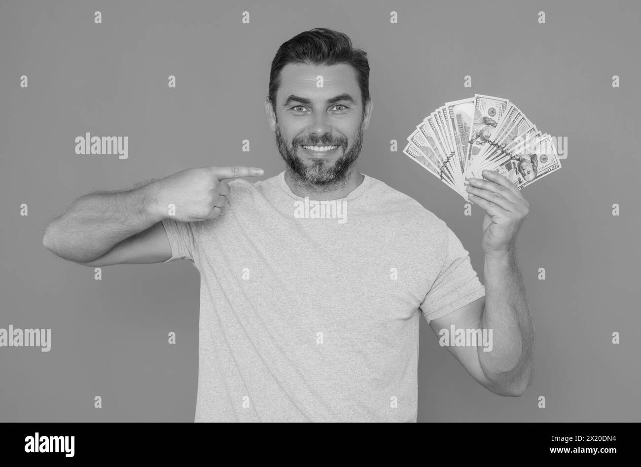 Man with money cash. Dollar banknotes. Portrait of man holding bunch of ...