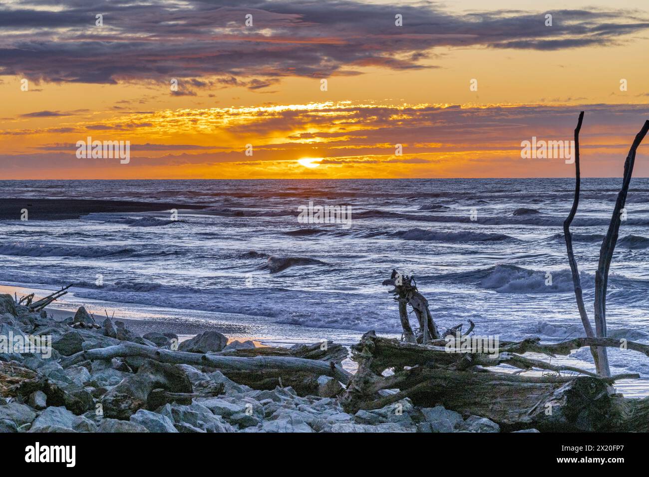 Brilliant Sunset over the Tasman Sea by Hokitika new Zealand Stock ...