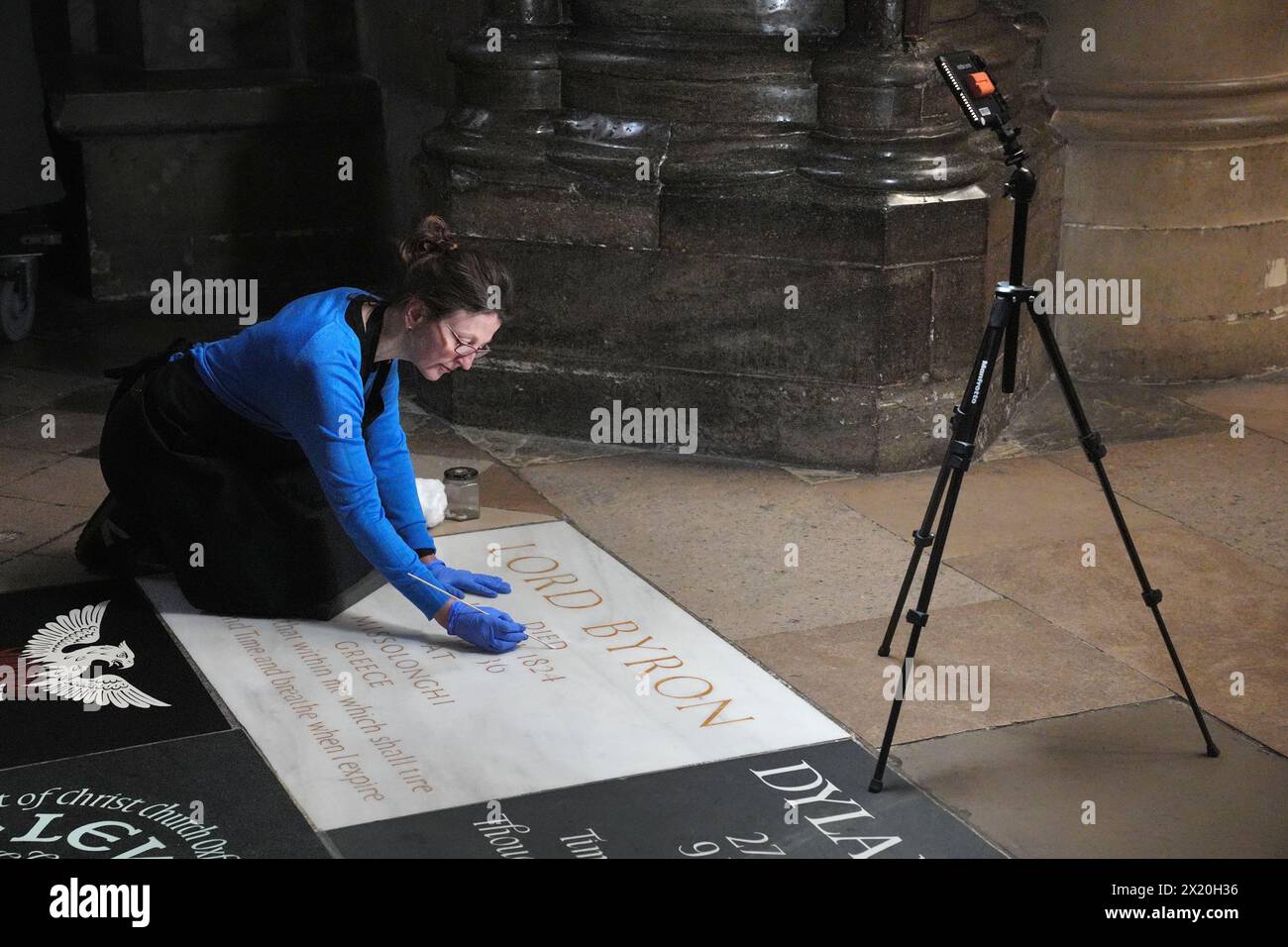 Conservator Lucy Ackland cleans Lord Byron's memorial stone in Poets ...
