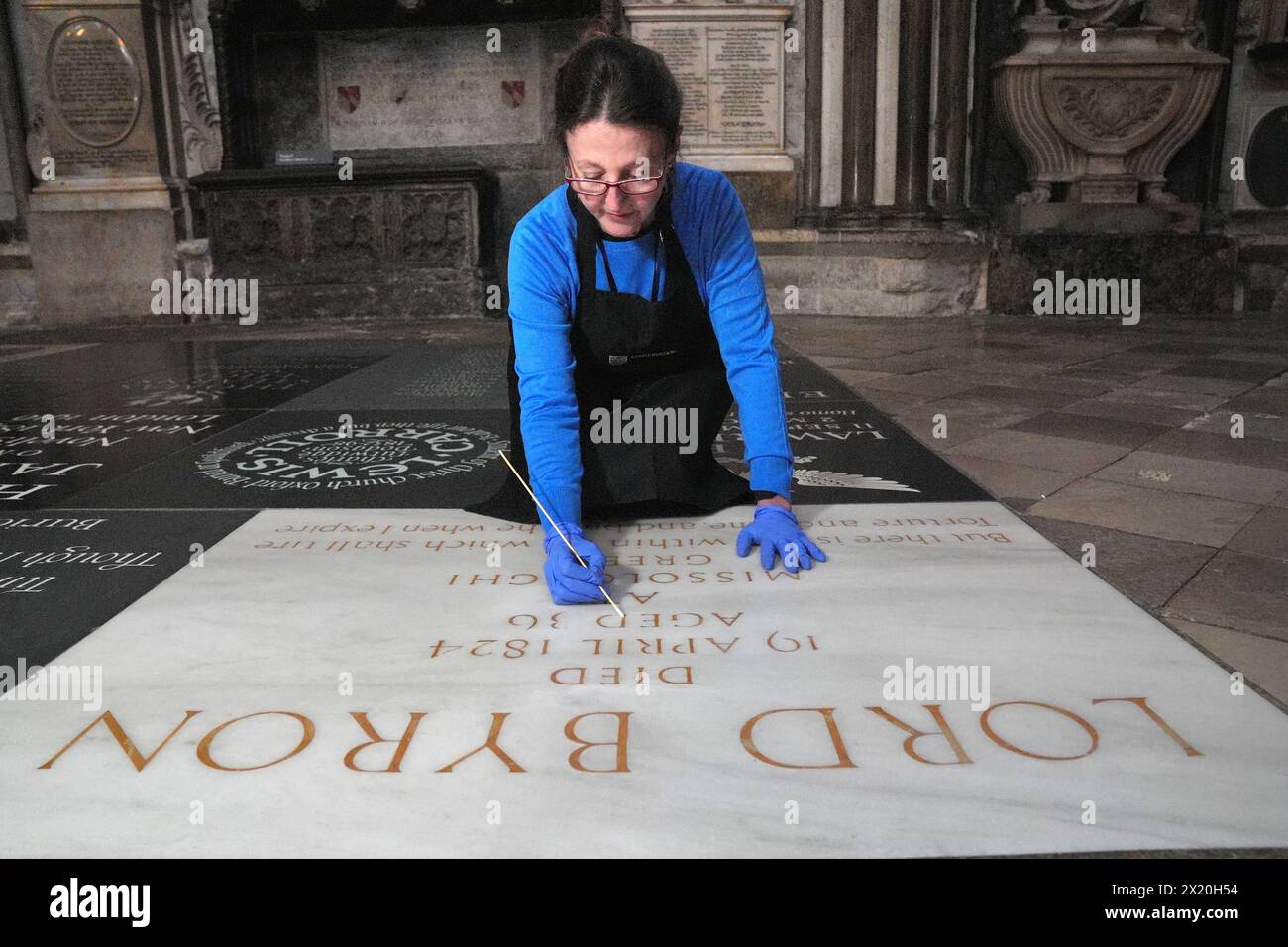 Conservator Lucy Ackland cleans Lord Byron's memorial stone in Poets ...