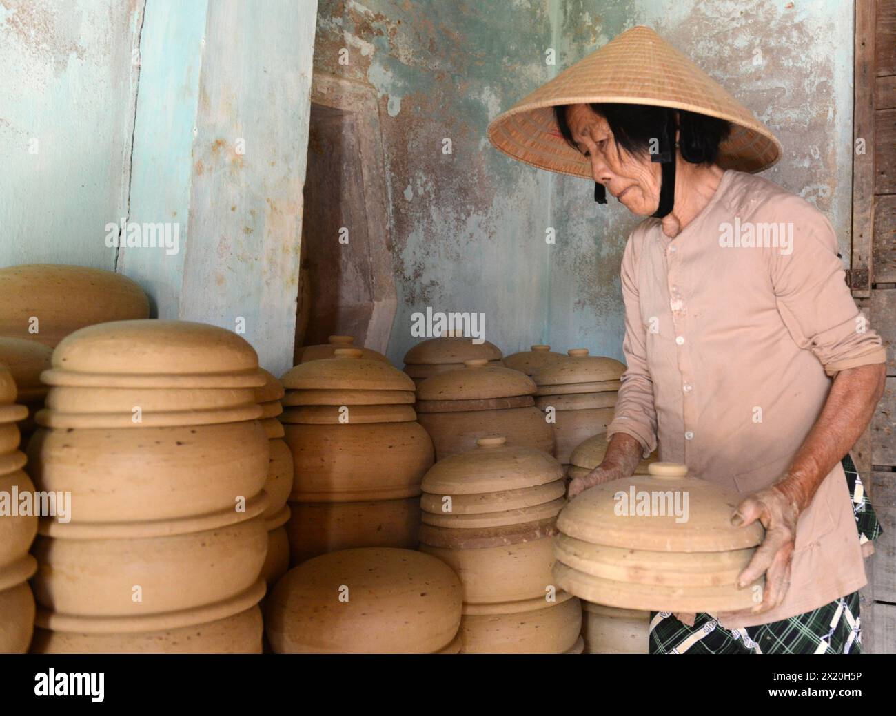 Traditional Clay pots production at Thanh Ha pottery village in Hoi An ...