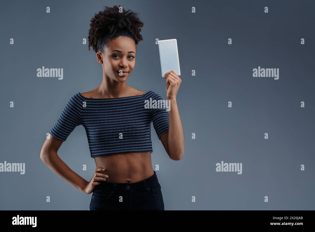 Tech-savvy female recommends app solutions, smartphone in hand, looking ...