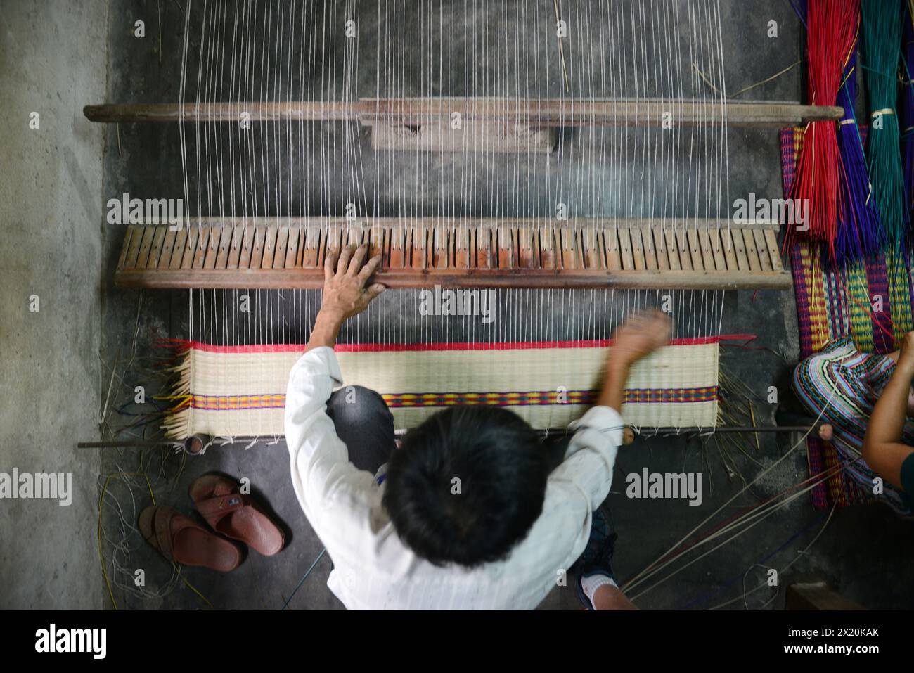 A mat weaver working in his home in a small village in Cẩm Kim, Hội An ...