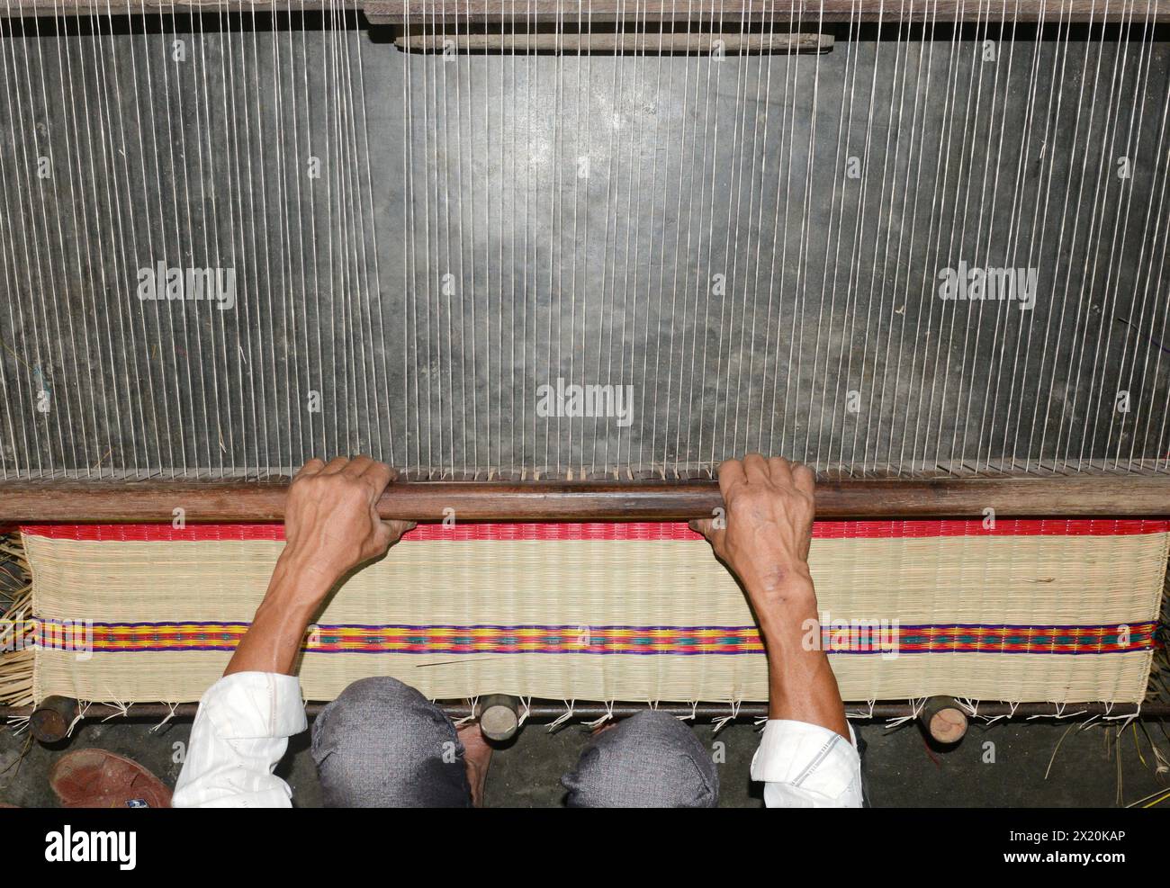A mat weaver working in his home in a small village in Cẩm Kim, Hội An ...