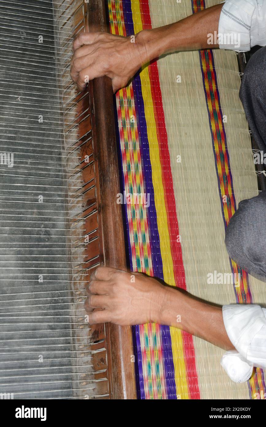 A mat weaver working in his home in a small village in Cẩm Kim, Hội An ...