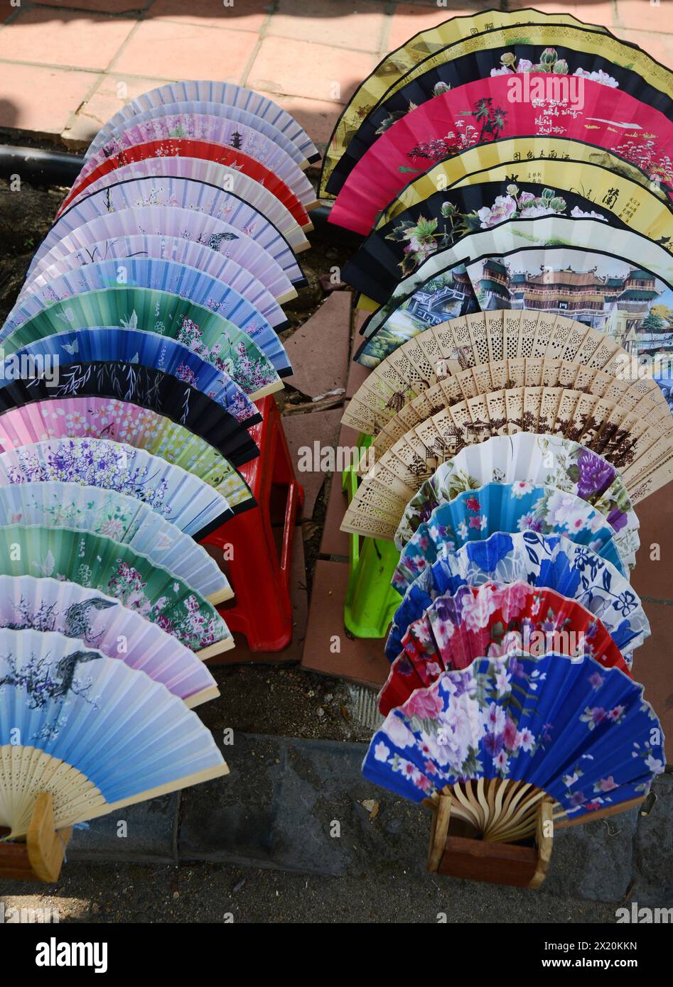 Vietnamese fans displayed by a souvenir shop in the old city of Hoi An ...