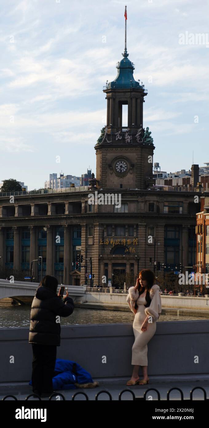 A woman poses for a photo against the General Post Office Building in ...