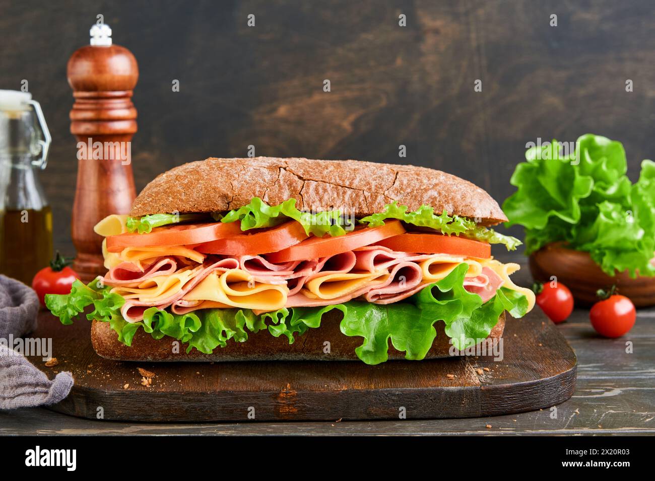 Sandwich. One fresh big submarine sandwich with ham, cheese, lettuce ...