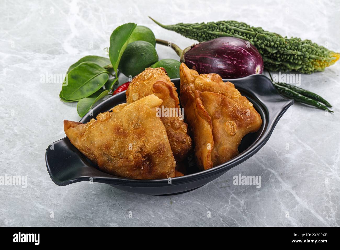 Indian cuisine - fries crispy stuffed samosa Stock Photo - Alamy