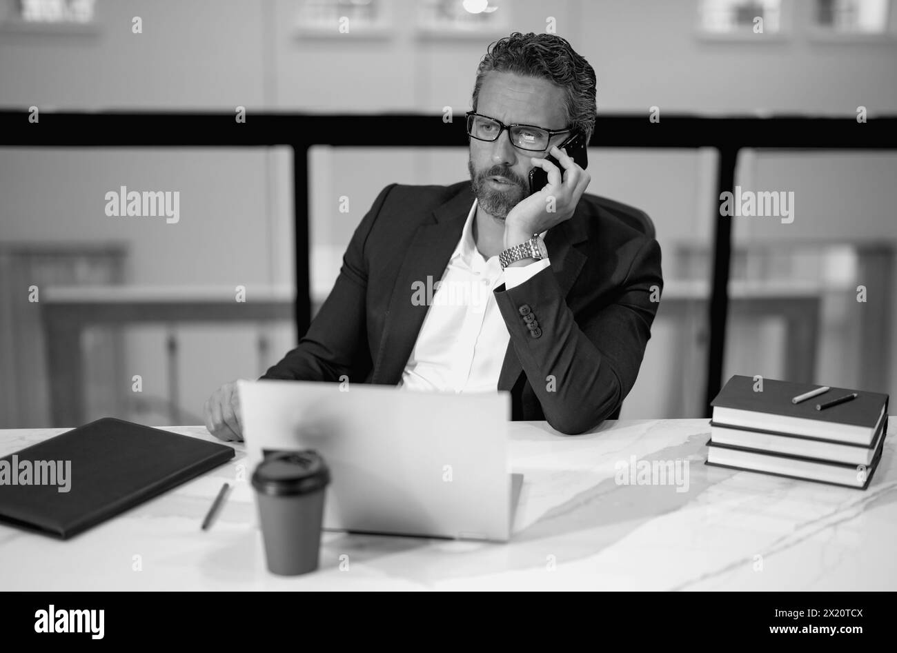 Business man talking on phone at office workplace. Employee remote ...