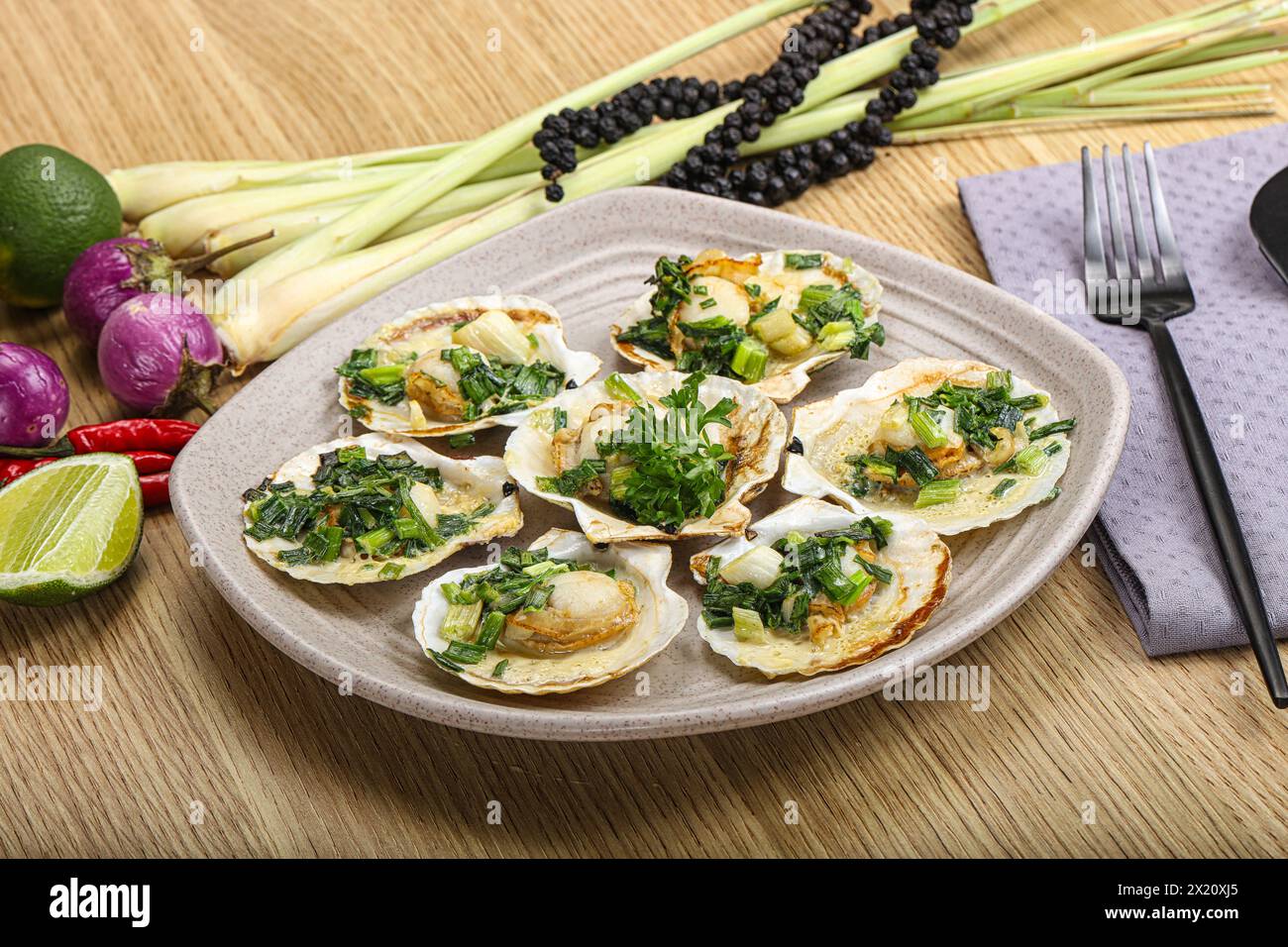 Grilled scallops with green onion and sauce Stock Photo - Alamy