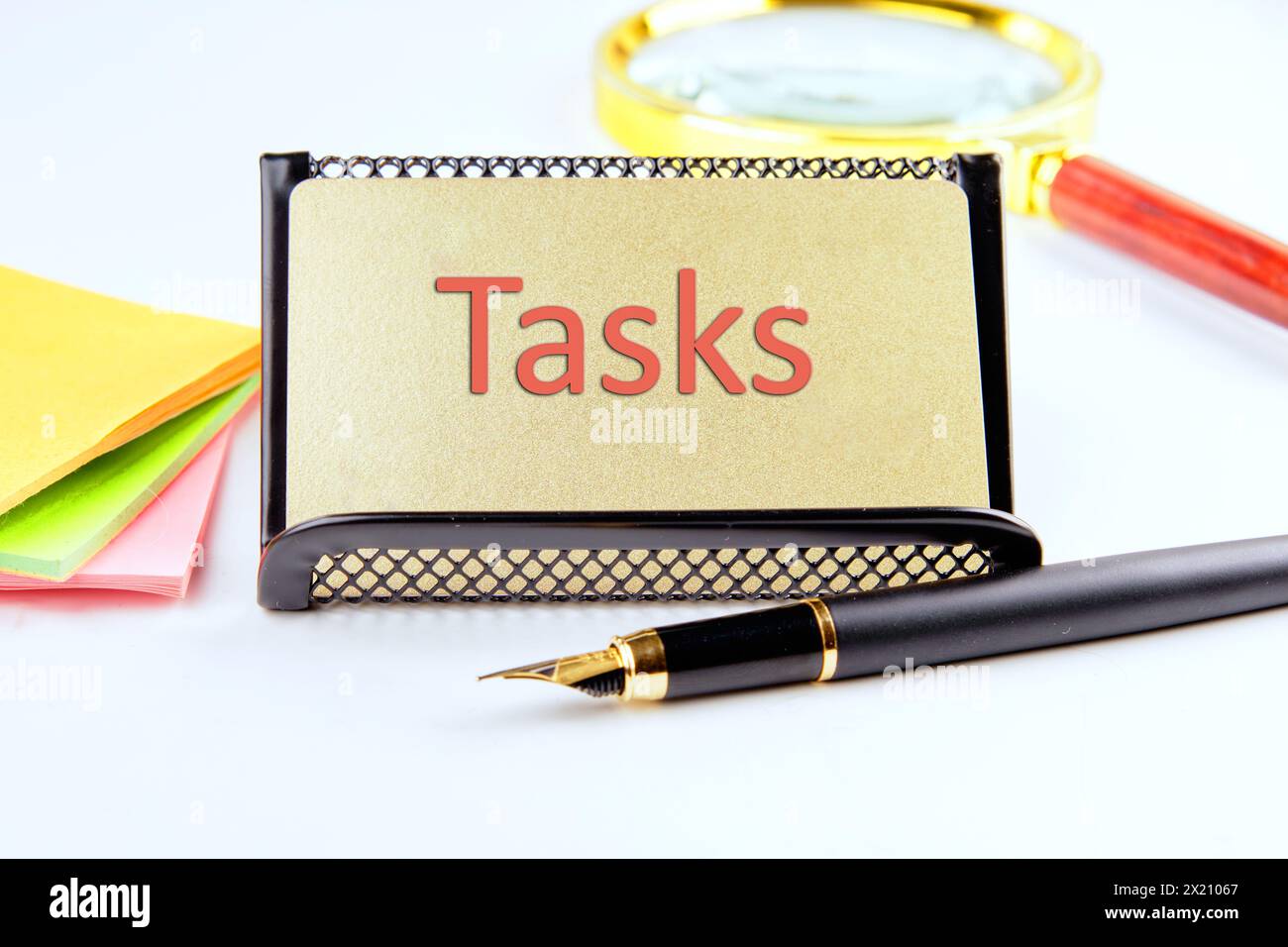 Business concept. TASKS - word on a gold business card with highlighted ...