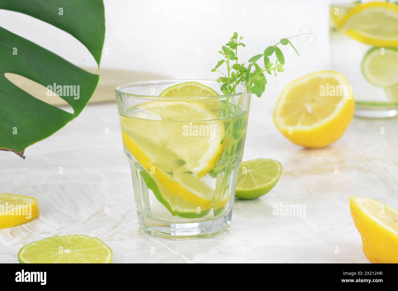 Citrus lemonade, yellow and green decorations on light background ...