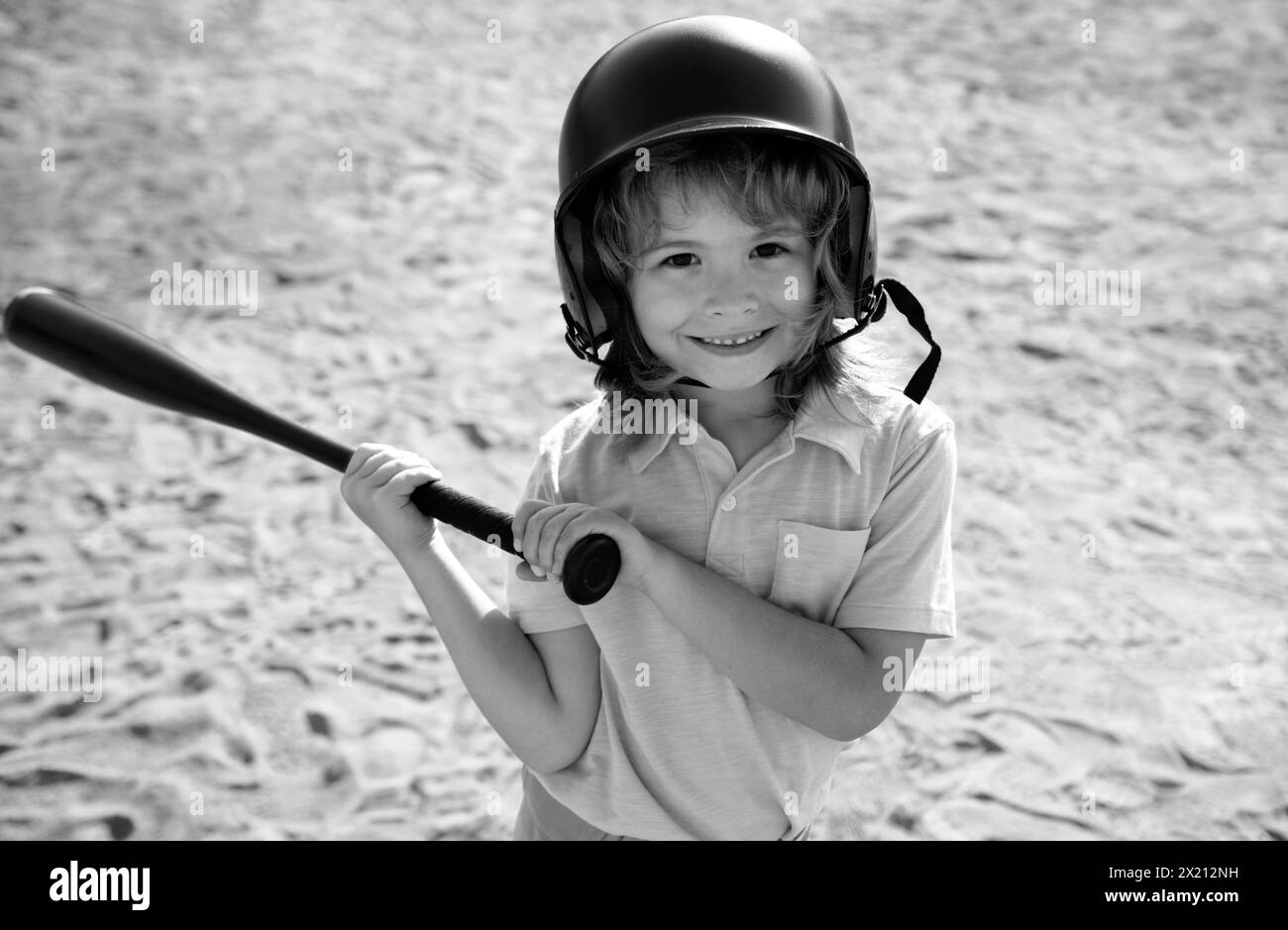 Child baseball player focused ready to bat. Kid holding a baseball bat ...
