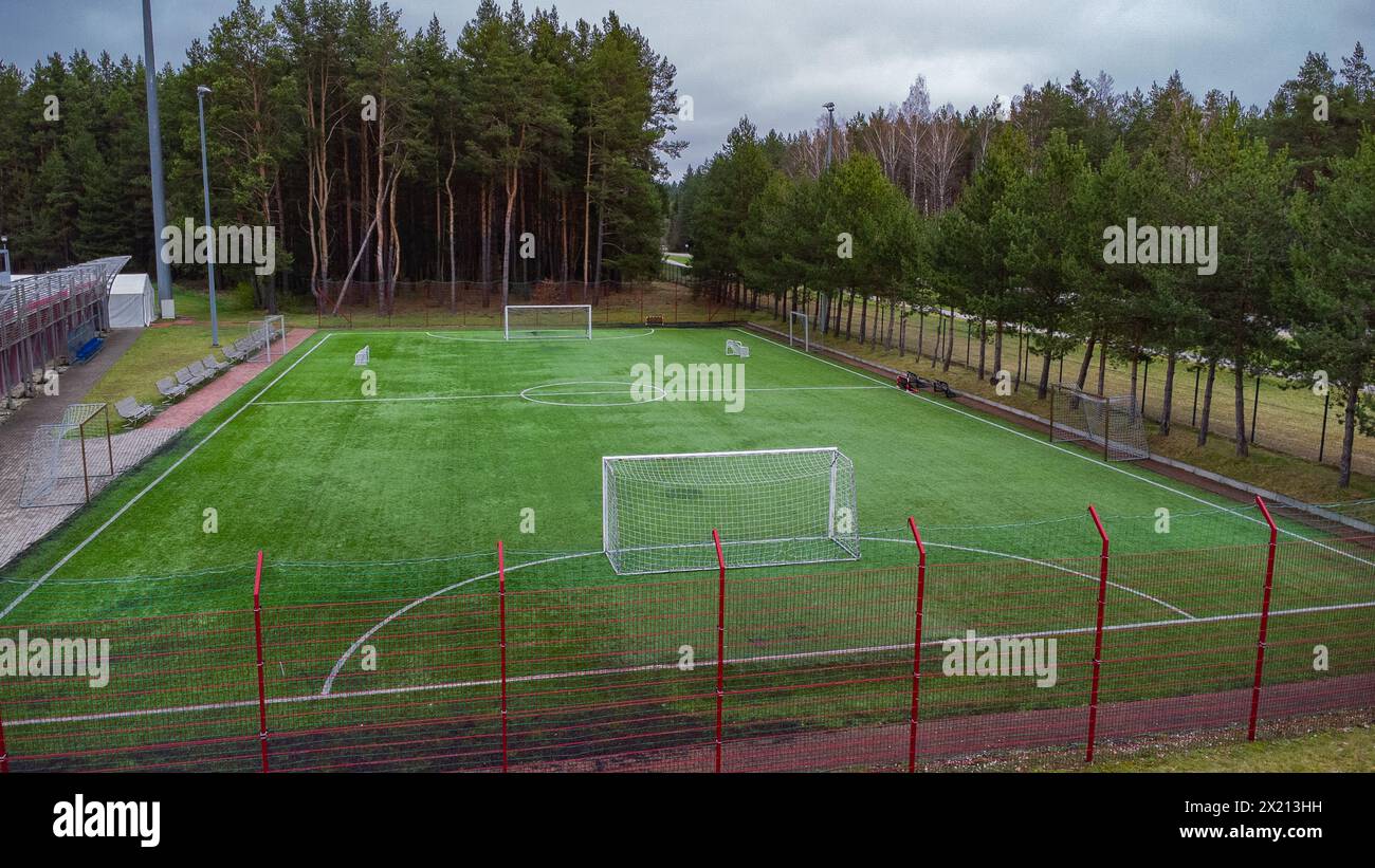 aerial view of an empty stadium, football field with green grass and ...