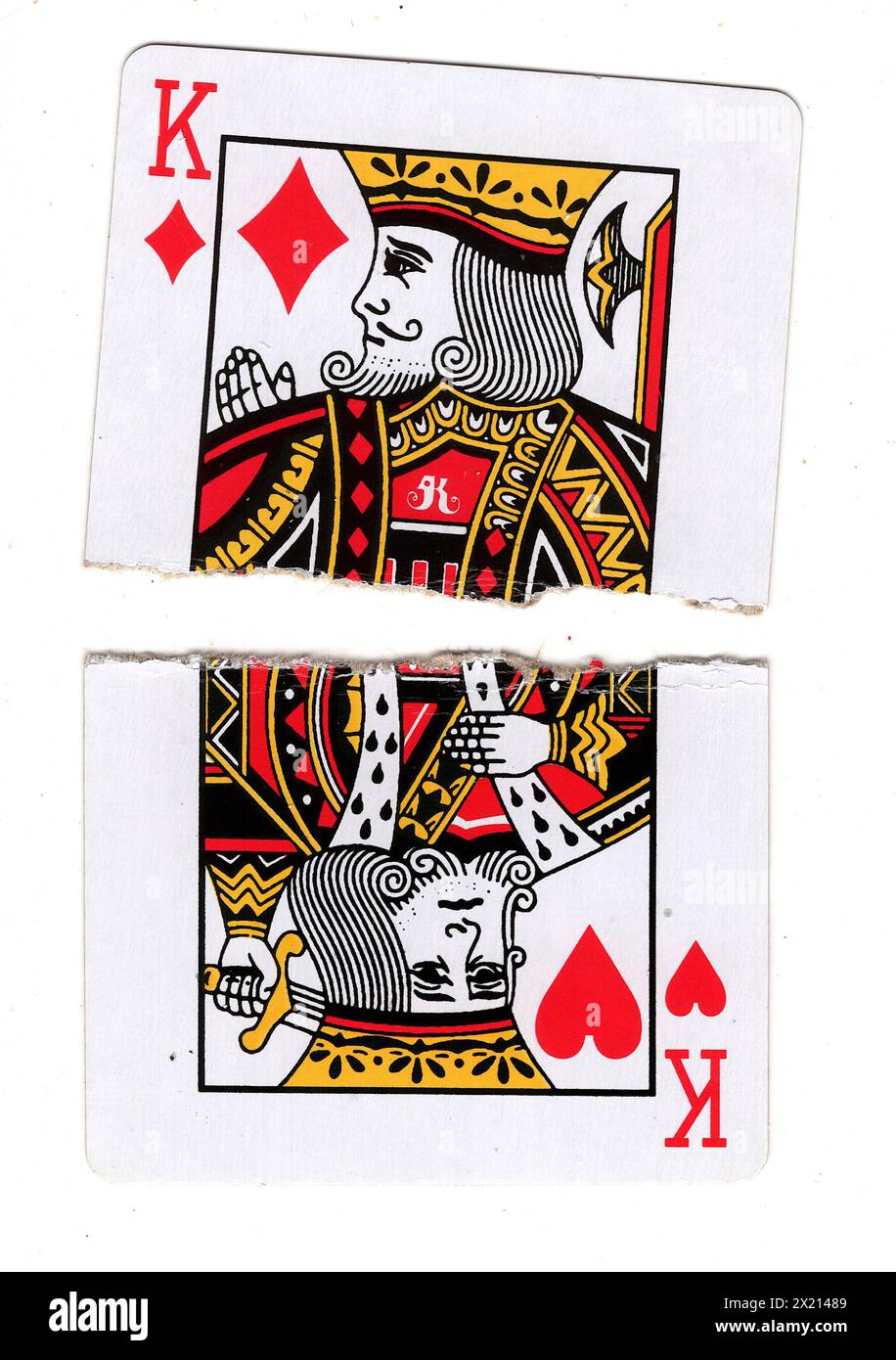 A king of diamonds and king of hearts playing cards torn in half on a ...