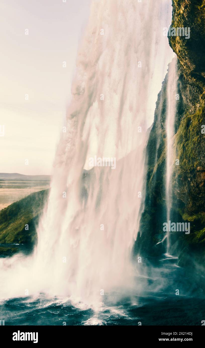 A waterfall is shown in the image, with a misty and serene atmosphere ...