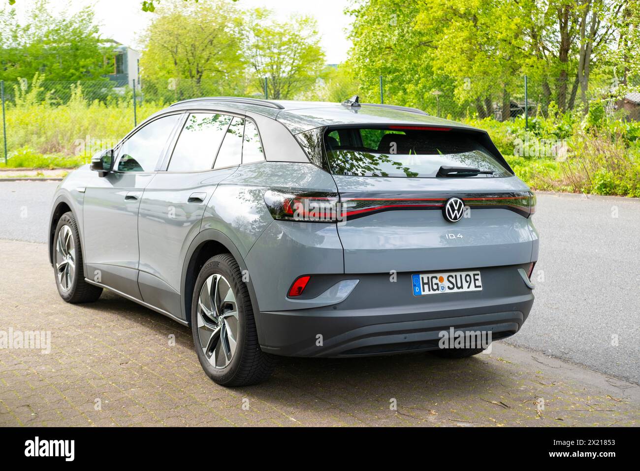 electric light blue car Volkswagen ID.4 on street, technology German ...
