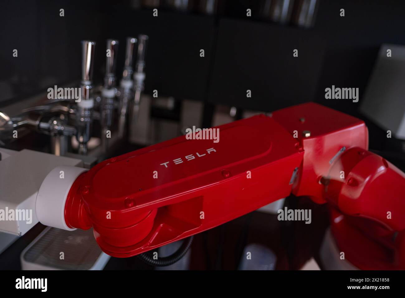 red programmable Tesla robotic mechanical arm with similar functions to ...