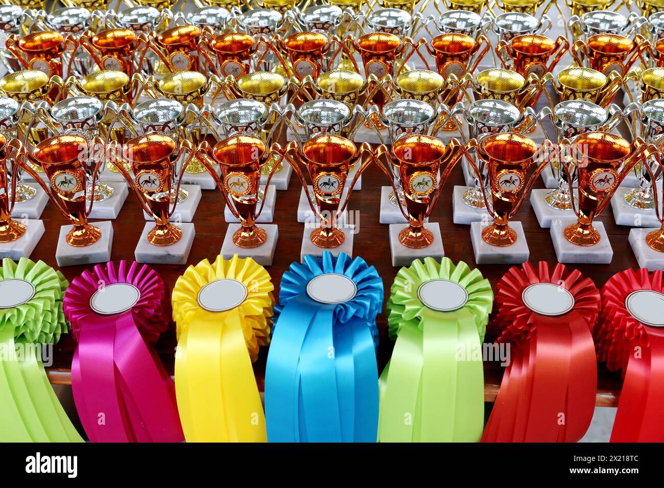 Group of beautiful colorful trophies and ribbons for the winners and ...