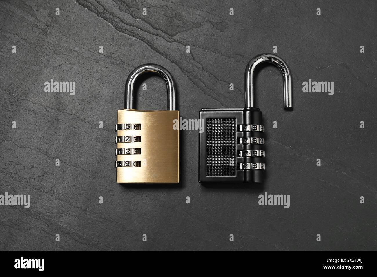 Steel combination padlocks on black table, top view Stock Photo - Alamy
