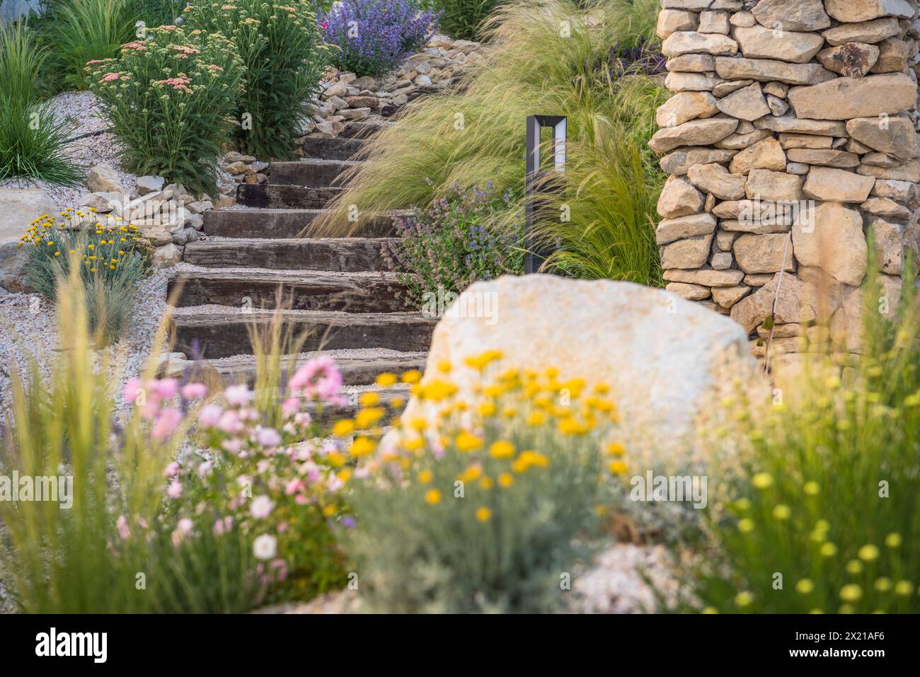 Rustic wooden stairs in the garden Stock Photo - Alamy
