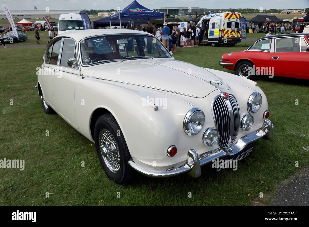 Three-quarter front view of a Cream, 1968, Jaguar 340 , on display at ...
